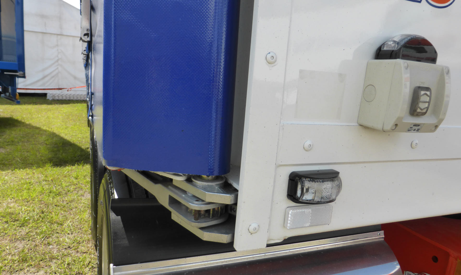 What is a curtainside or tautliner truck or trailer?