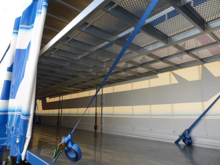 What is a curtainside or tautliner truck or trailer?