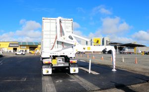 Truck position when loading and unloading a container using a sideloader